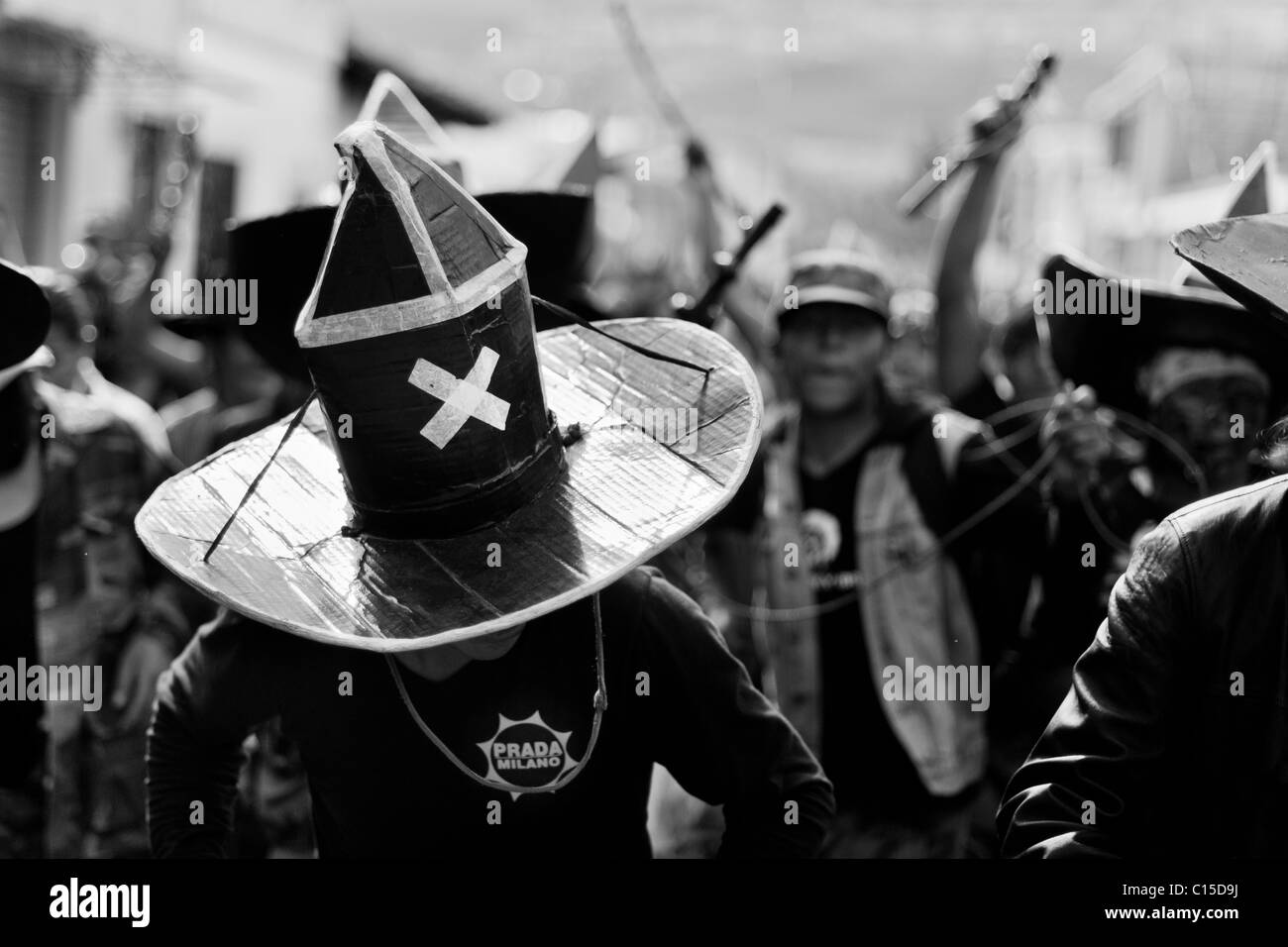 Indians, wearing black cardboard hats, dance wildly during the Inti ...