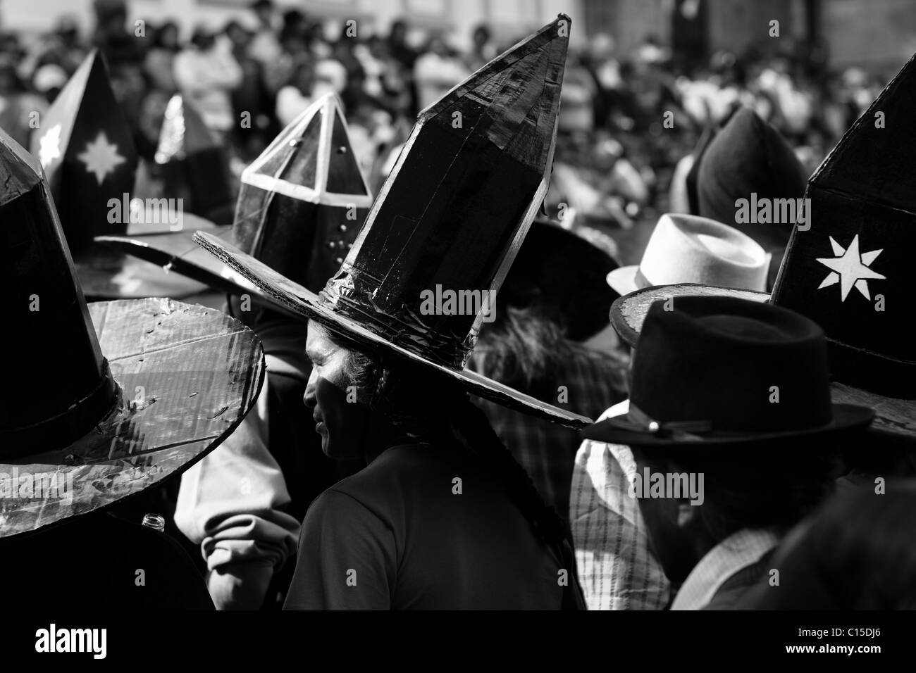 Indians, wearing black cardboard hats, dance during the Inti Raymi (San ...