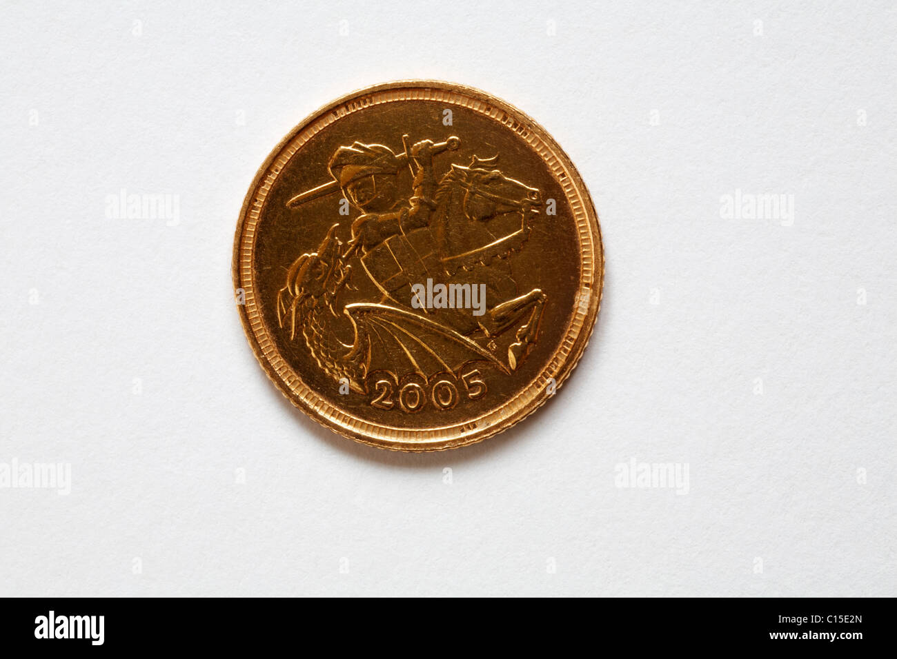 One gold half sovereign showing tail side isolated on white background ...