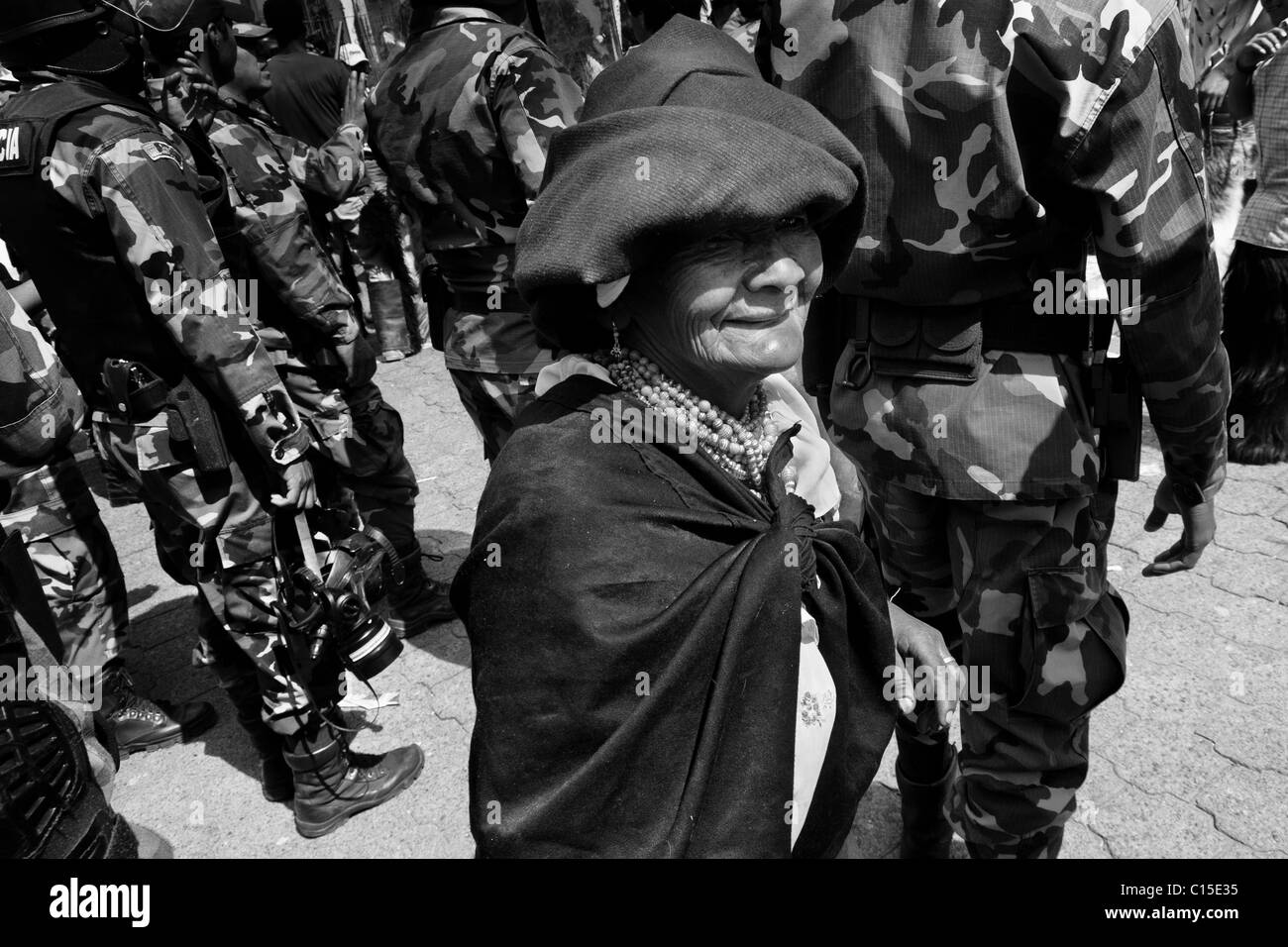 An old Indian woman walks in front the riot policemen during the Inti ...