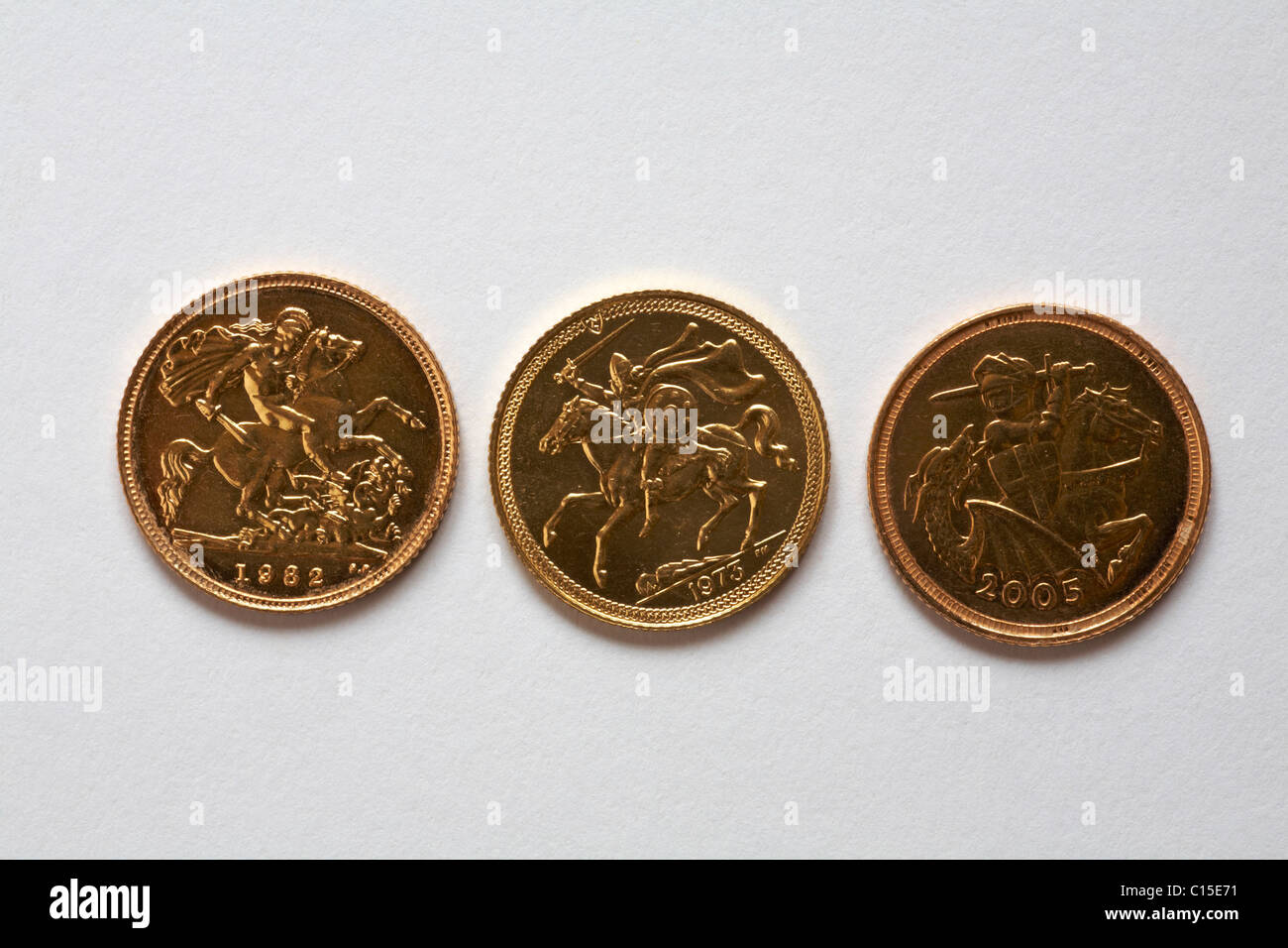 Three gold half sovereigns, showing different tail designs, isolated on ...