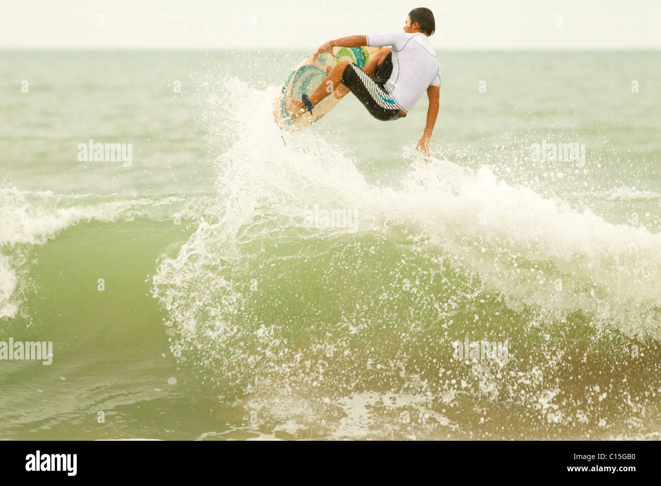 Surfing Ending The Wave With A Jump Stock Photo - Alamy