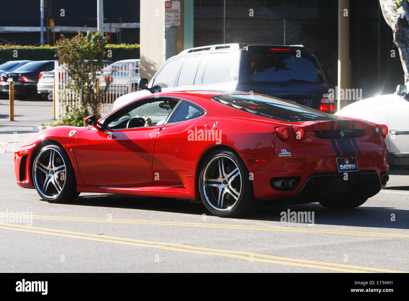 Chris Brown cruising at Melrose Avenue in his red Ferrari Los Angeles ...