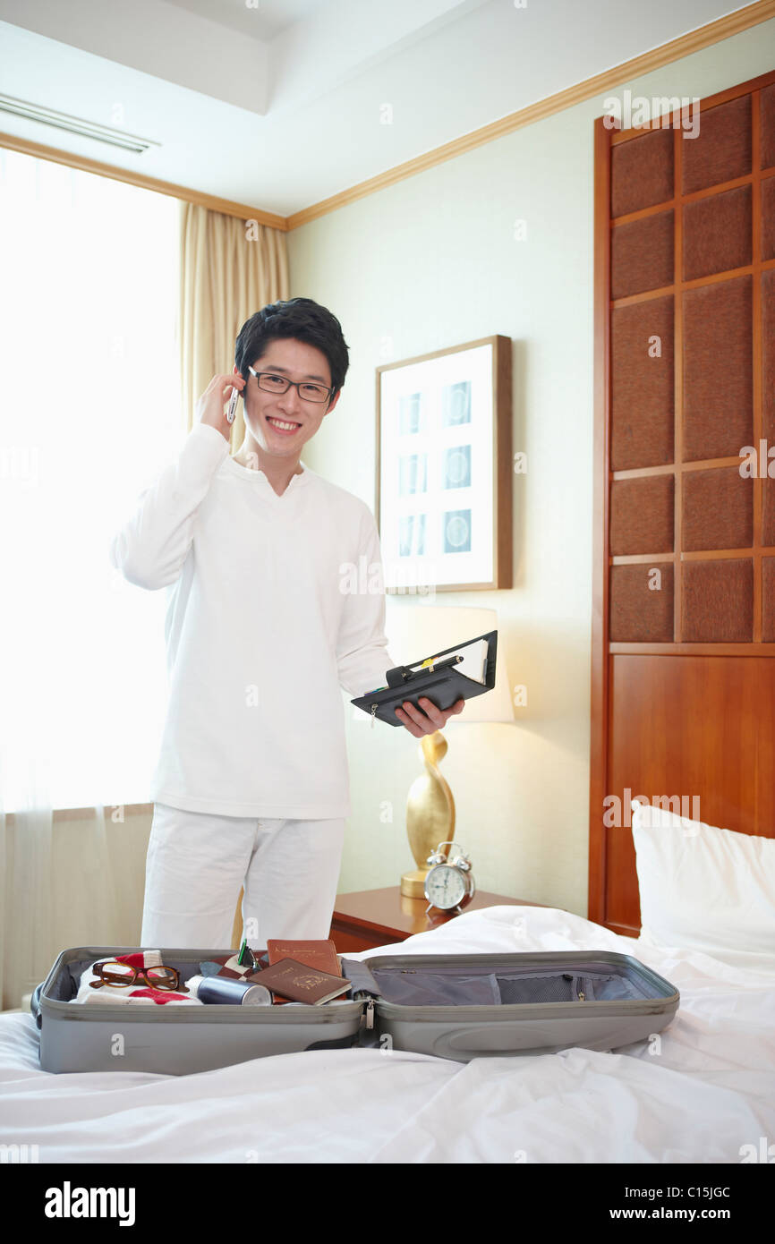 man on the line checking the luggage Stock Photo - Alamy