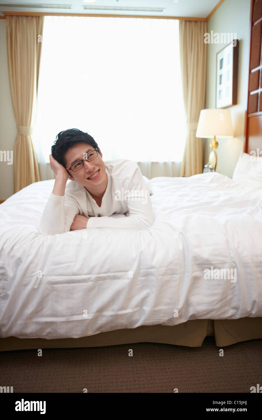 man lying down the bed Stock Photo - Alamy