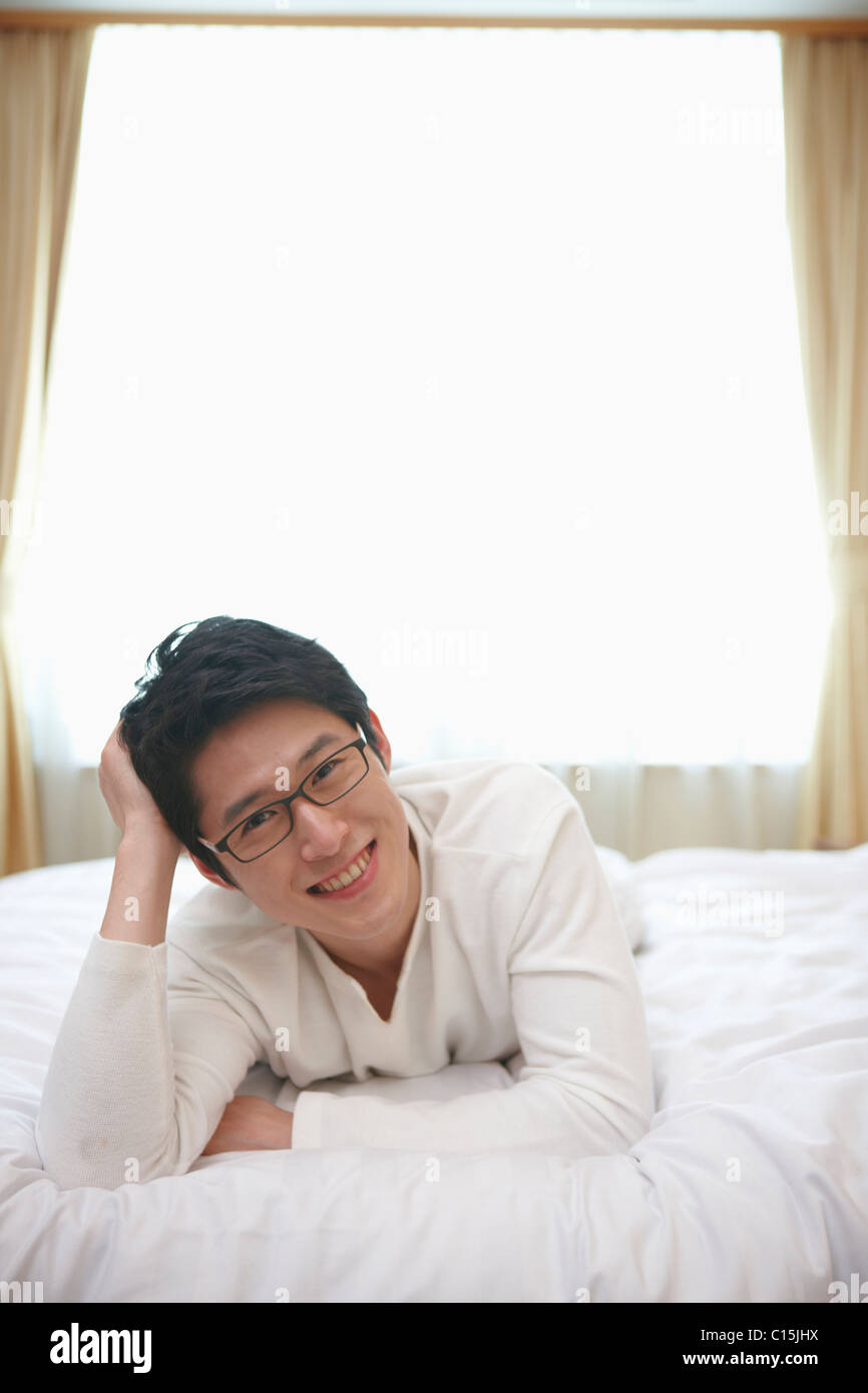 man lying down the bed Stock Photo - Alamy