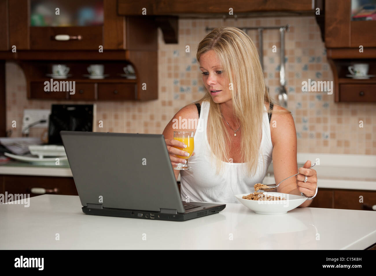 Rushed Breakfast, eating, drinking and reading at the same time Stock ...