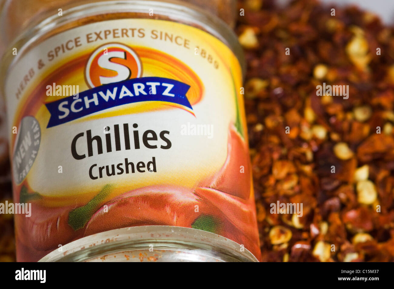 Crushed Chilli's on a white background Stock Photo - Alamy