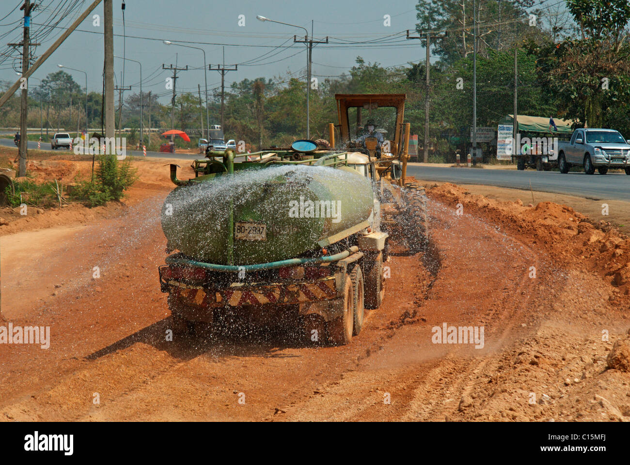 water tanker spraying dry sand,Chiang Saen,Thailand Stock Photo - Alamy