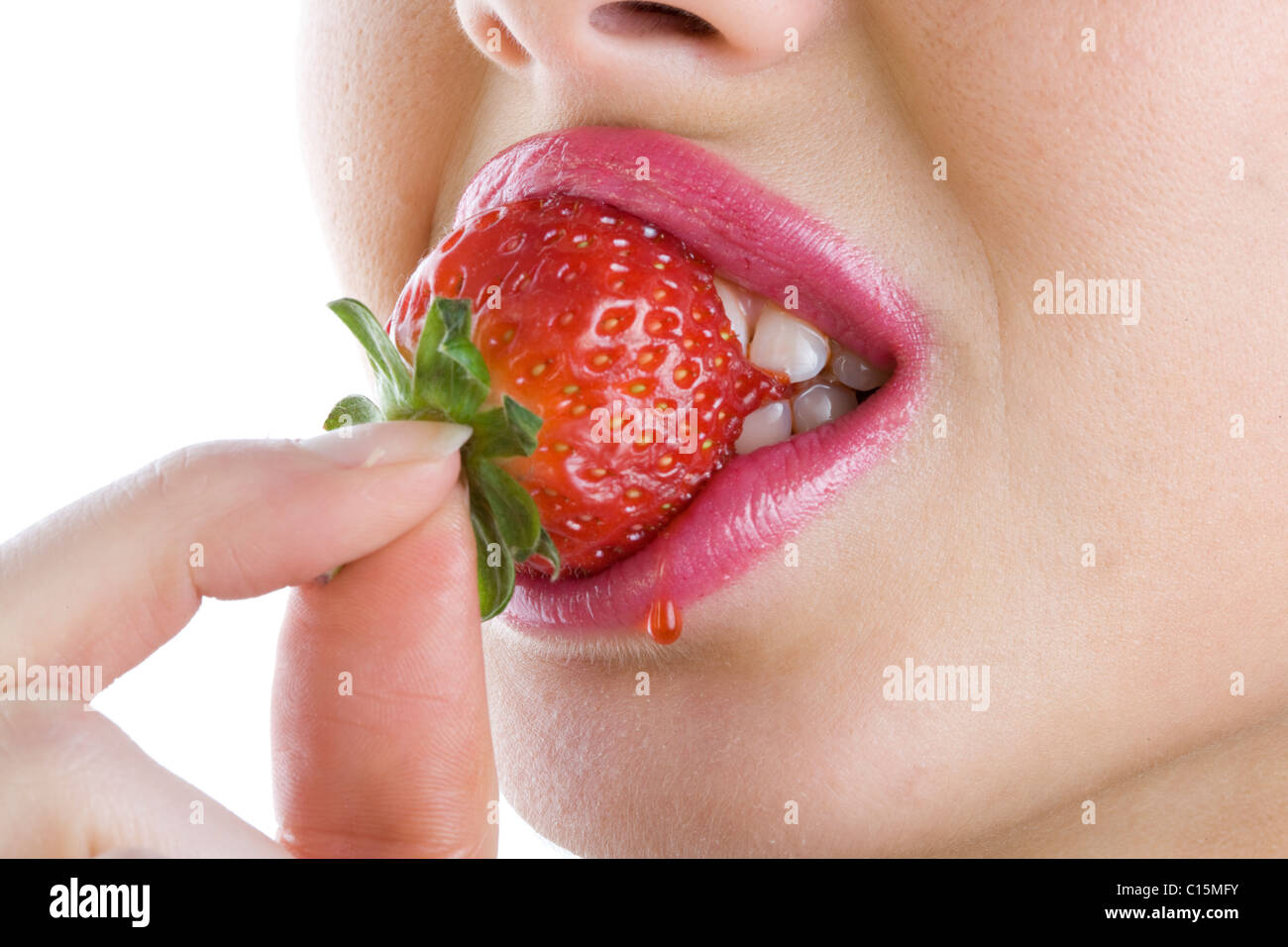 Girl eating a Strawberry Stock Photo - Alamy