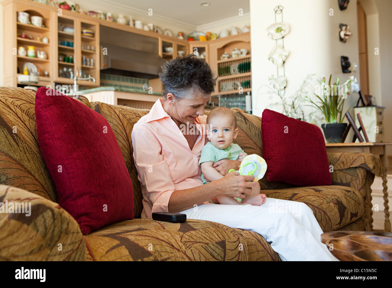Older woman babysitting hi-res stock photography and images - Alamy
