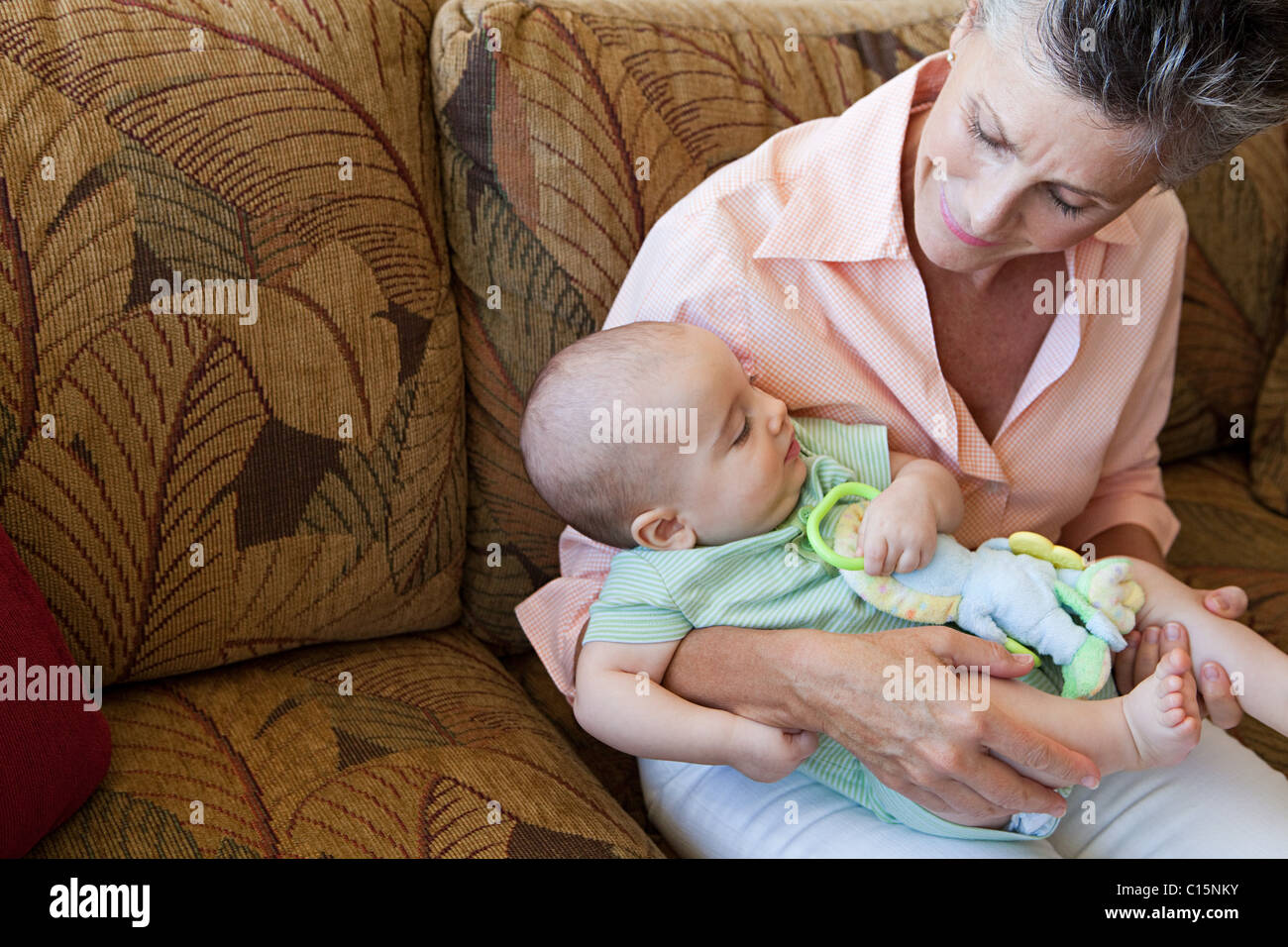 Older woman babysitting hi-res stock photography and images - Alamy