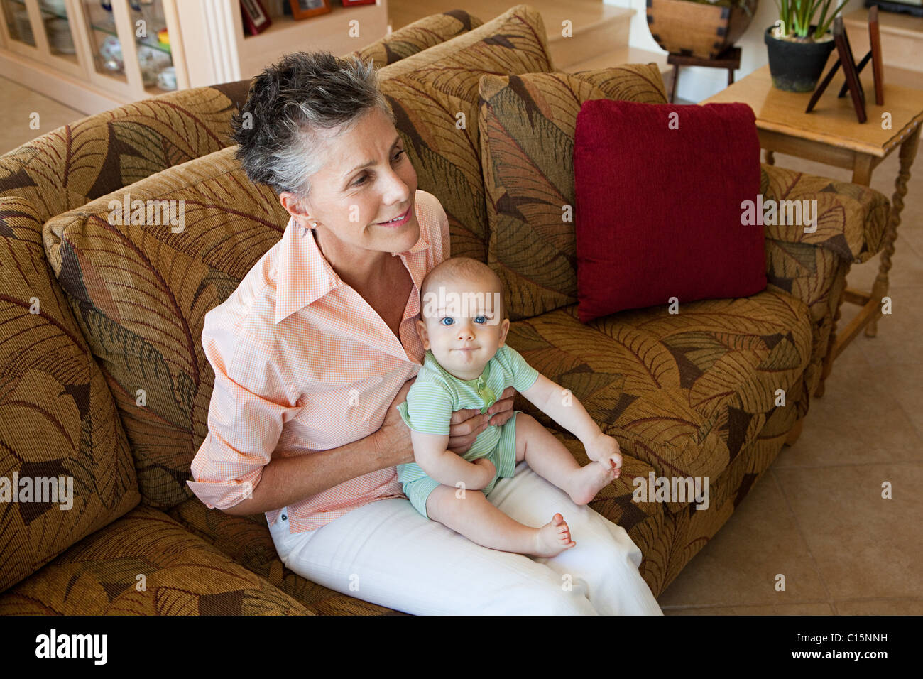 Older woman babysitting hi-res stock photography and images - Alamy