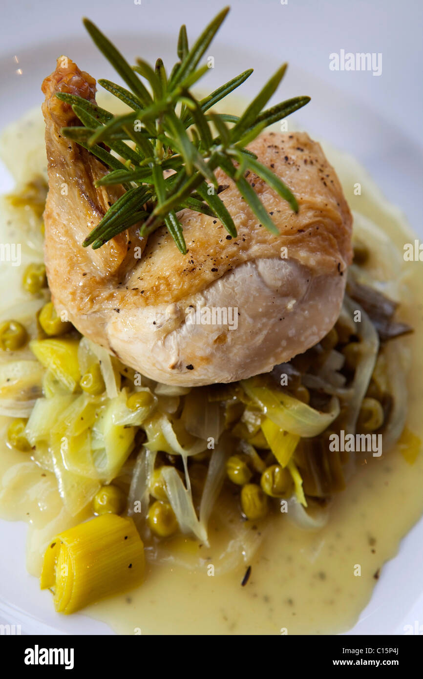 Main course: Chicken supreme on a leek, pea & onion cassoulet with a ...