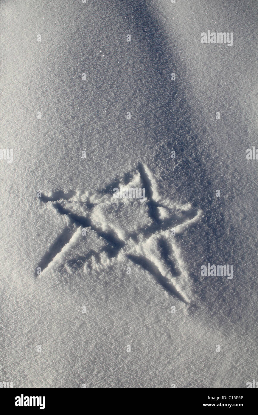 Star in snow Stock Photo - Alamy