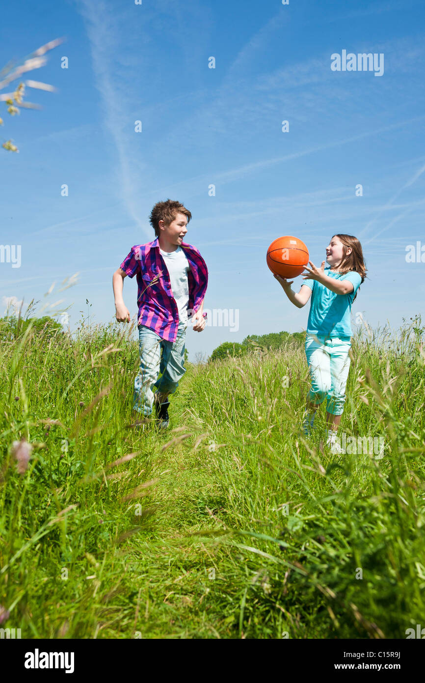Boy running over grass hi-res stock photography and images - Alamy