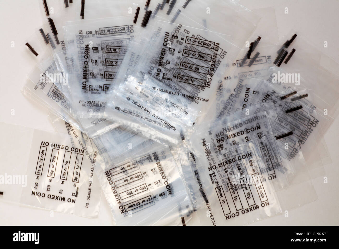pile of empty coin bags on white background Stock Photo - Alamy