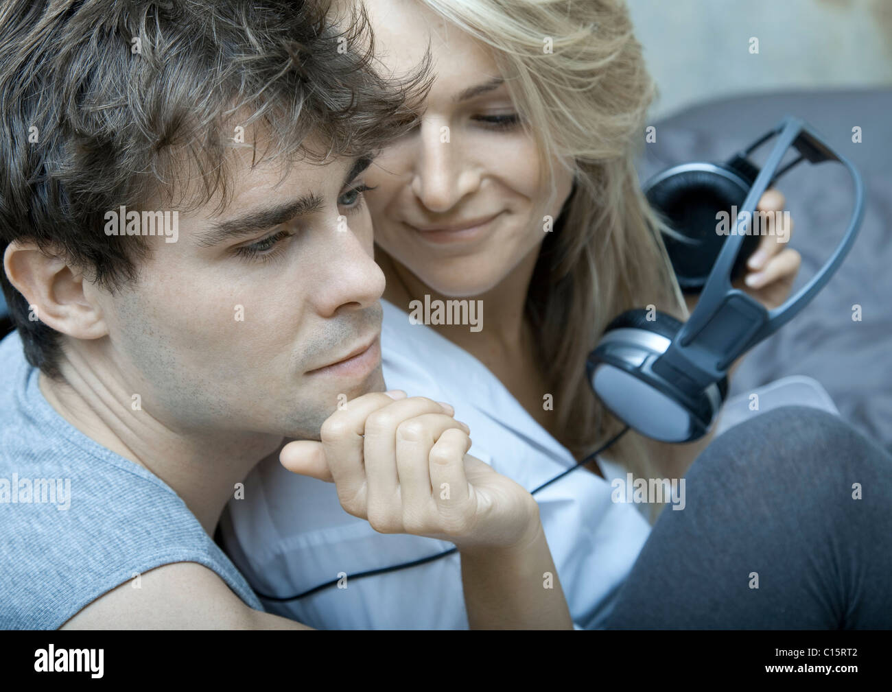 Young couple headphones Stock Photo - Alamy