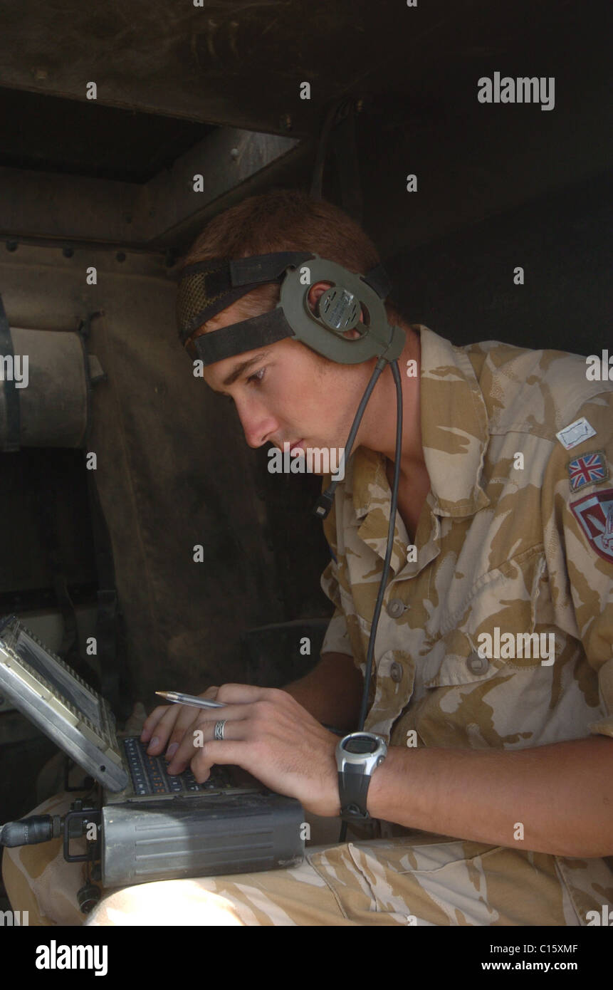 a British solder using a laptop in the field Stock Photo - Alamy