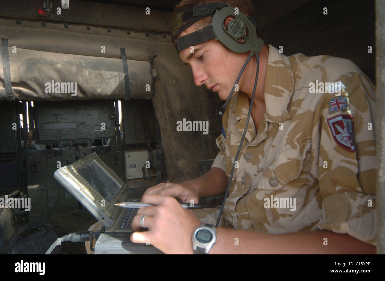 a British solder using a laptop in the field Stock Photo - Alamy