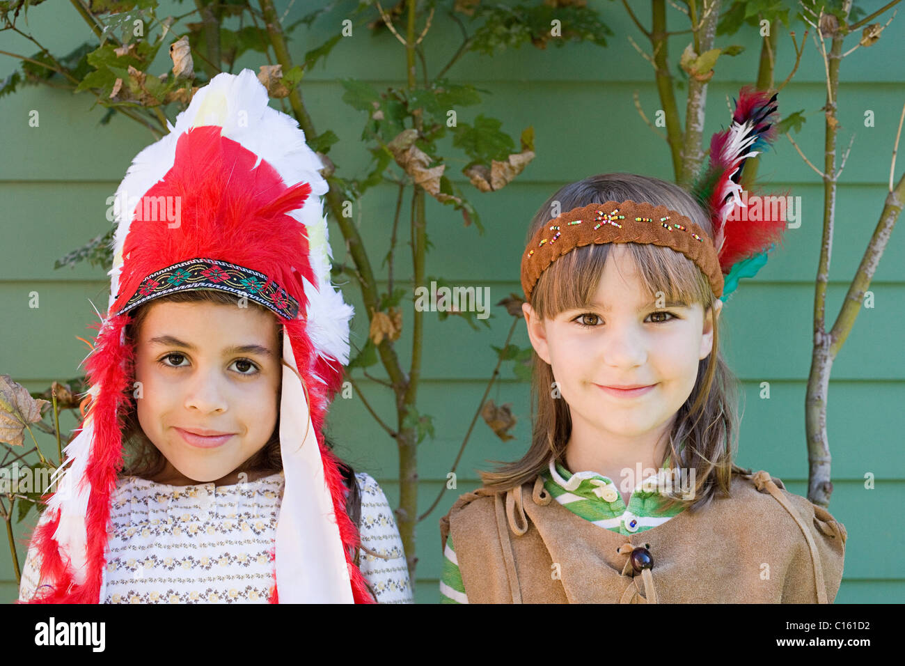 Two girls in Native American costumes Stock Photo - Alamy