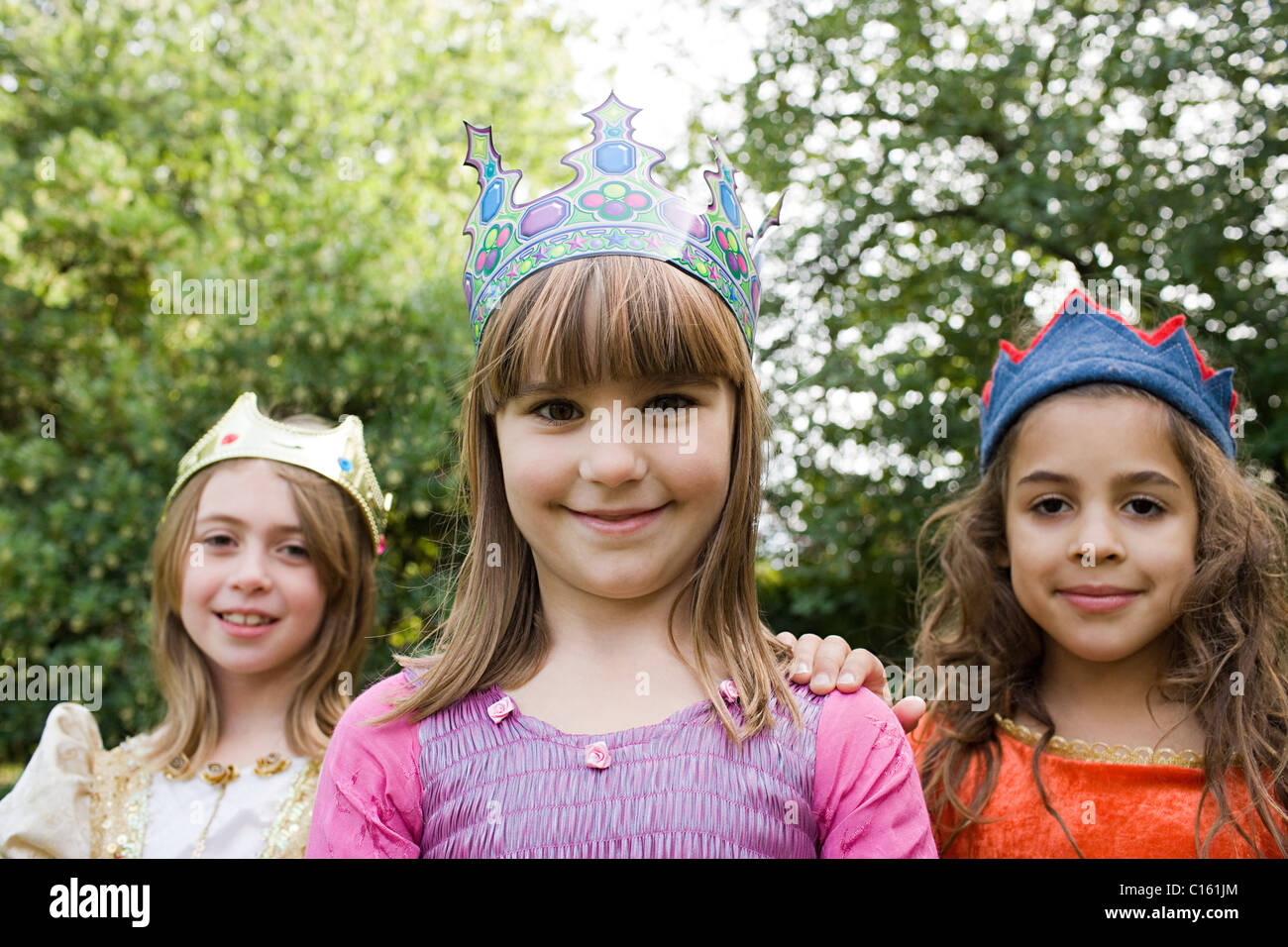 Girls wearing crown dressed up as queens Stock Photo - Alamy