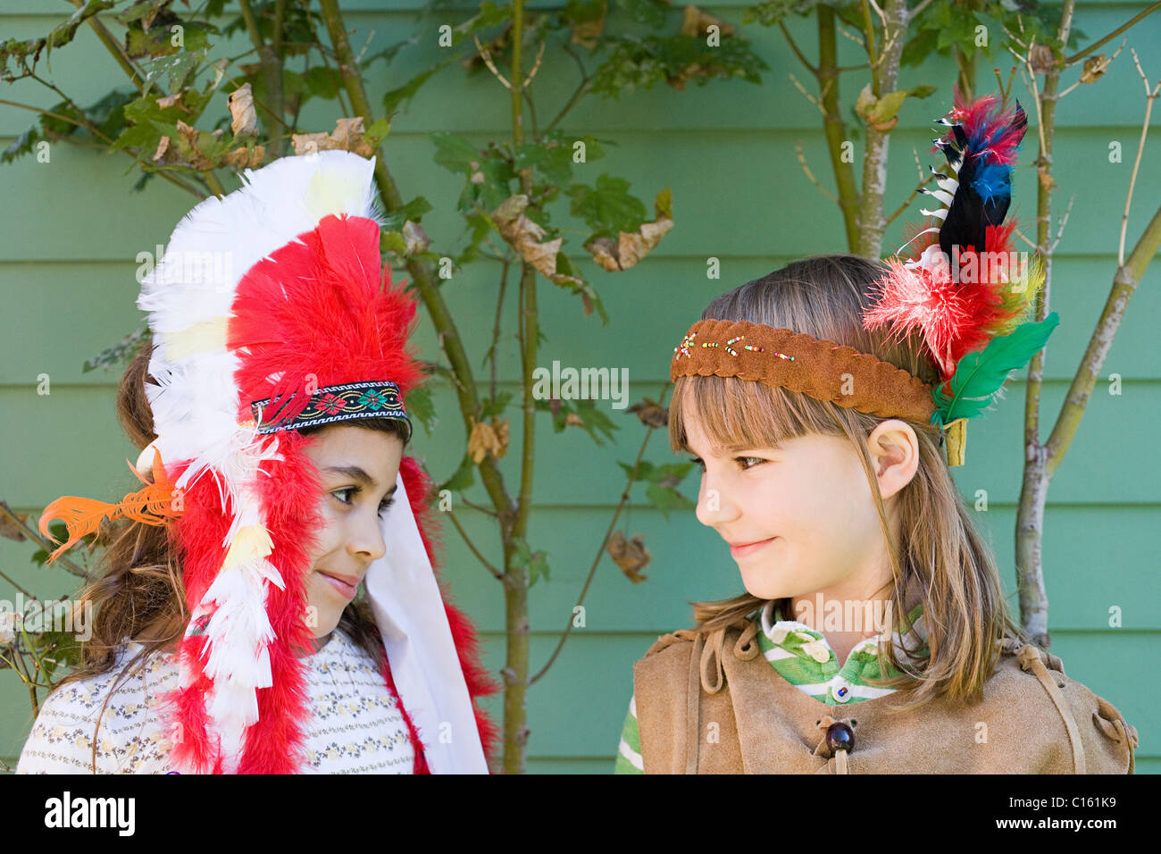 Two girls in Native American costumes Stock Photo - Alamy