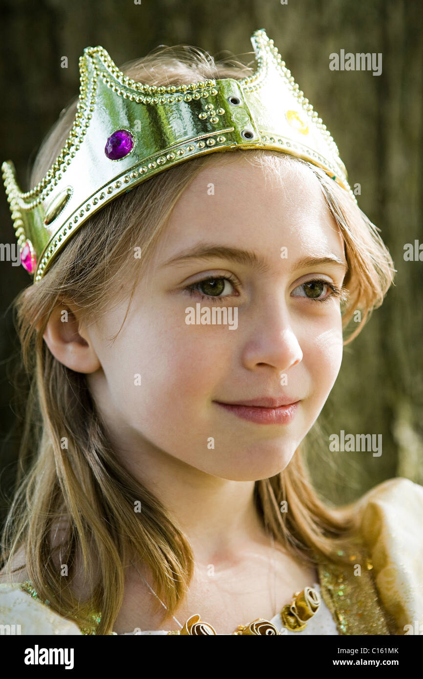 Girl wearing crown dressed up as queen Stock Photo - Alamy