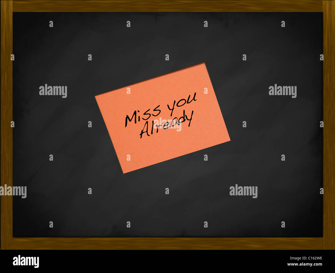 Miss you note on a post-it stuck on a framed blackboard Stock Photo - Alamy
