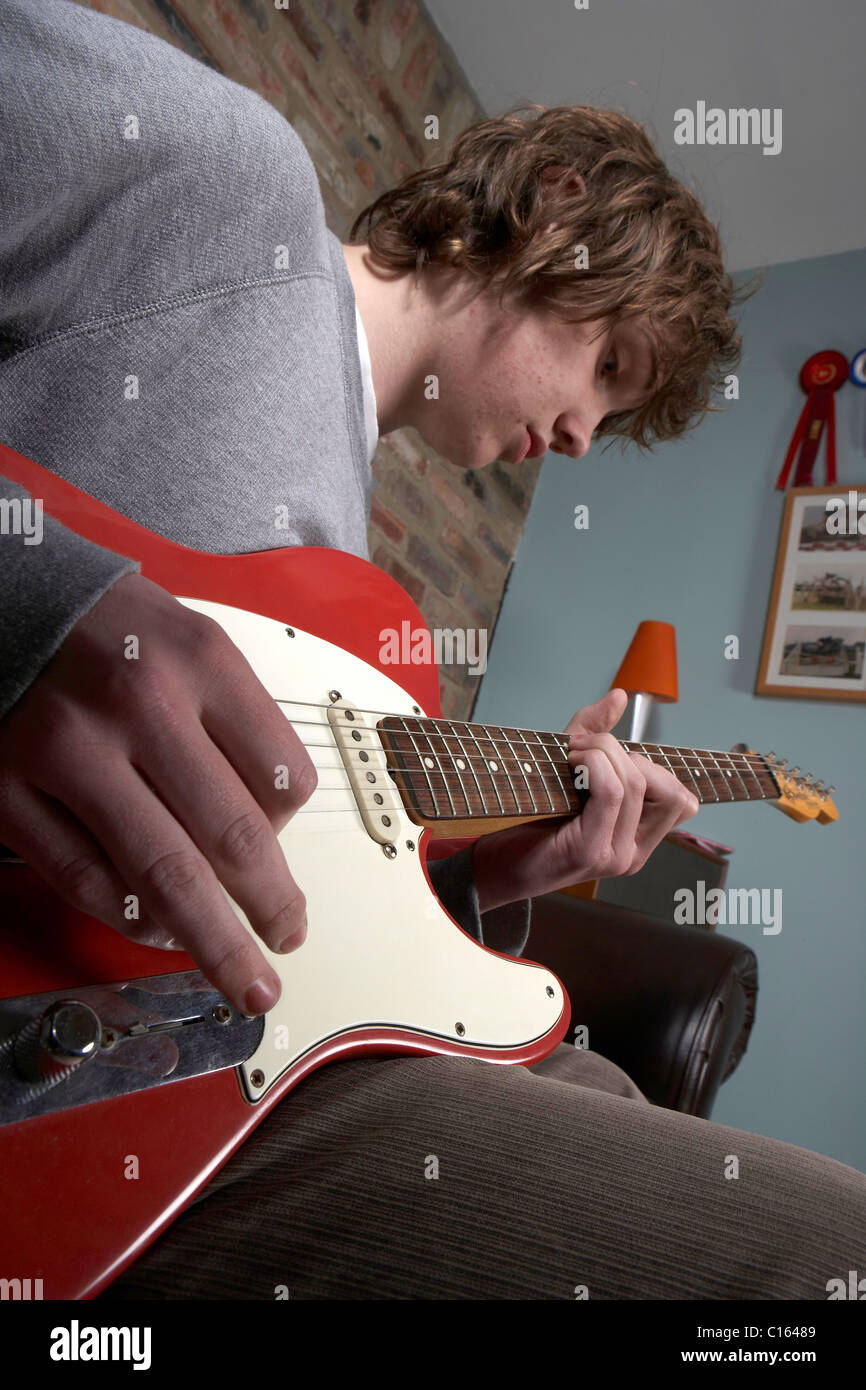 Teenage boy playing vintage electric telecaster fender guitar Stock ...