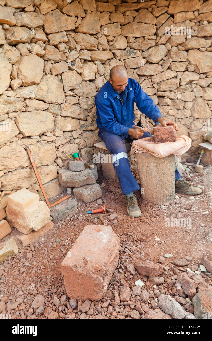 A traditional stone mason working at the Ecomuseo de la Alcogida at ...