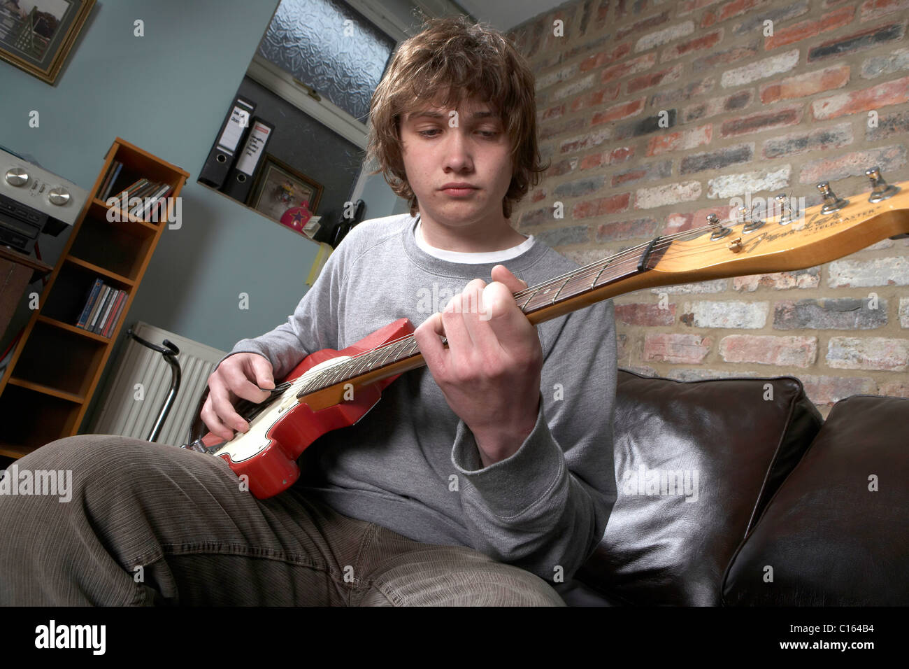 Teenage boy playing vintage electric telecaster fender guitar Stock ...