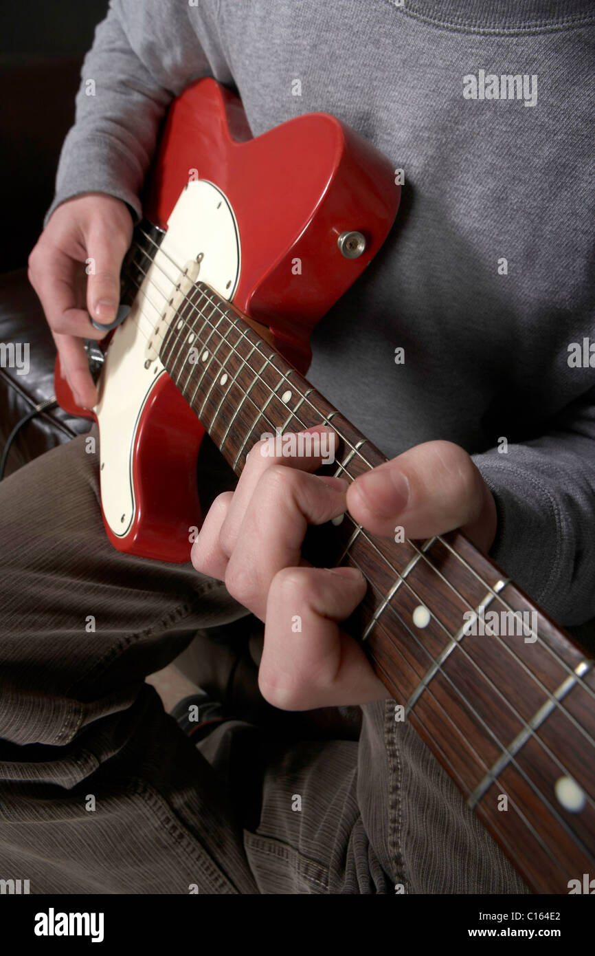 Teenage boy playing vintage electric telecaster fender guitar Stock ...
