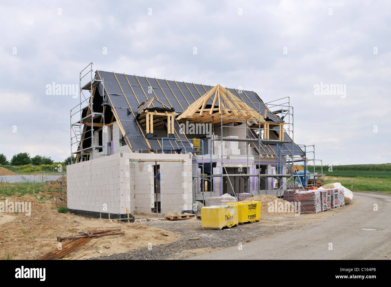 Shell of a building, construction in progress on the roof truss, Eifel ...