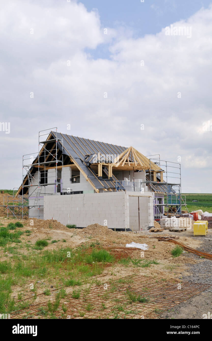 Scaffolded shell construction with roof truss in building, Eifel ...