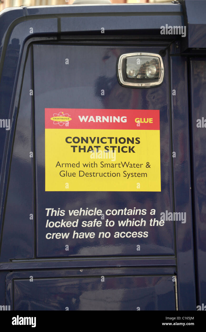 Warning sticker on the back of a cash collection security van in ...