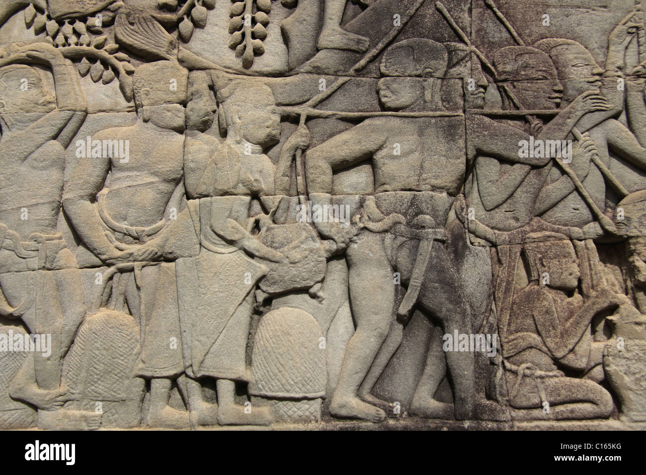 Bas-relief in the outer gallery of the Bayon, a temple located inside ...