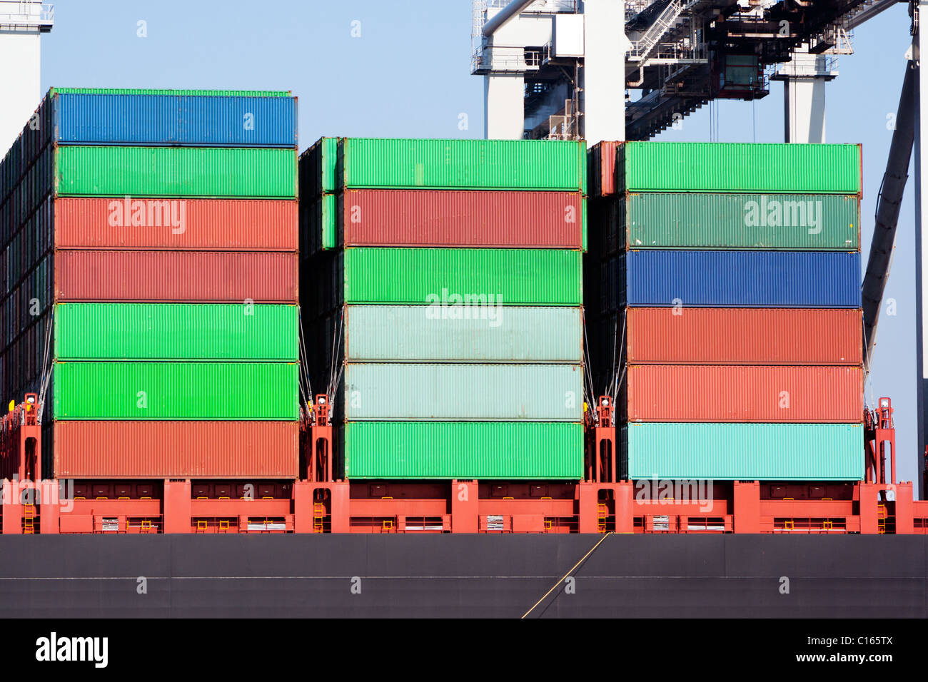 Stacked containers on ship deck in harbor Stock Photo - Alamy