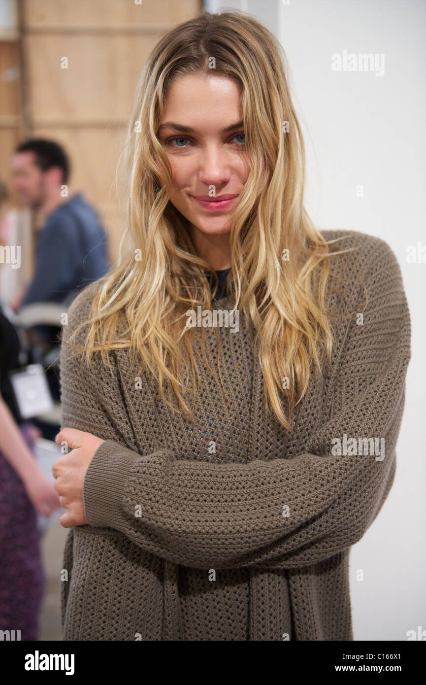 A model poses for a photograph backstage before the Matthew Williamson ...