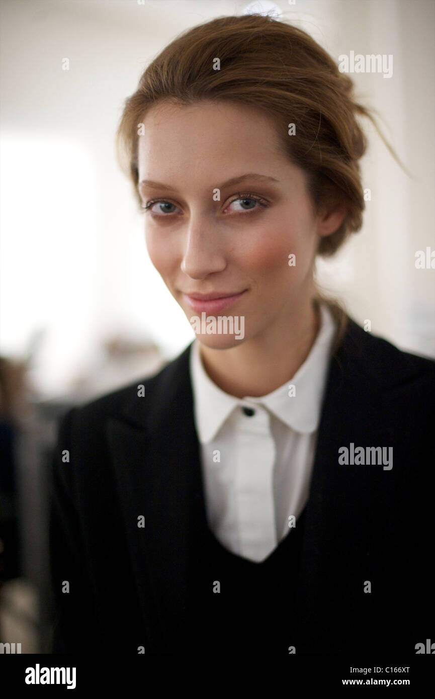 A model poses for a photograph backstage before the Matthew Williamson ...