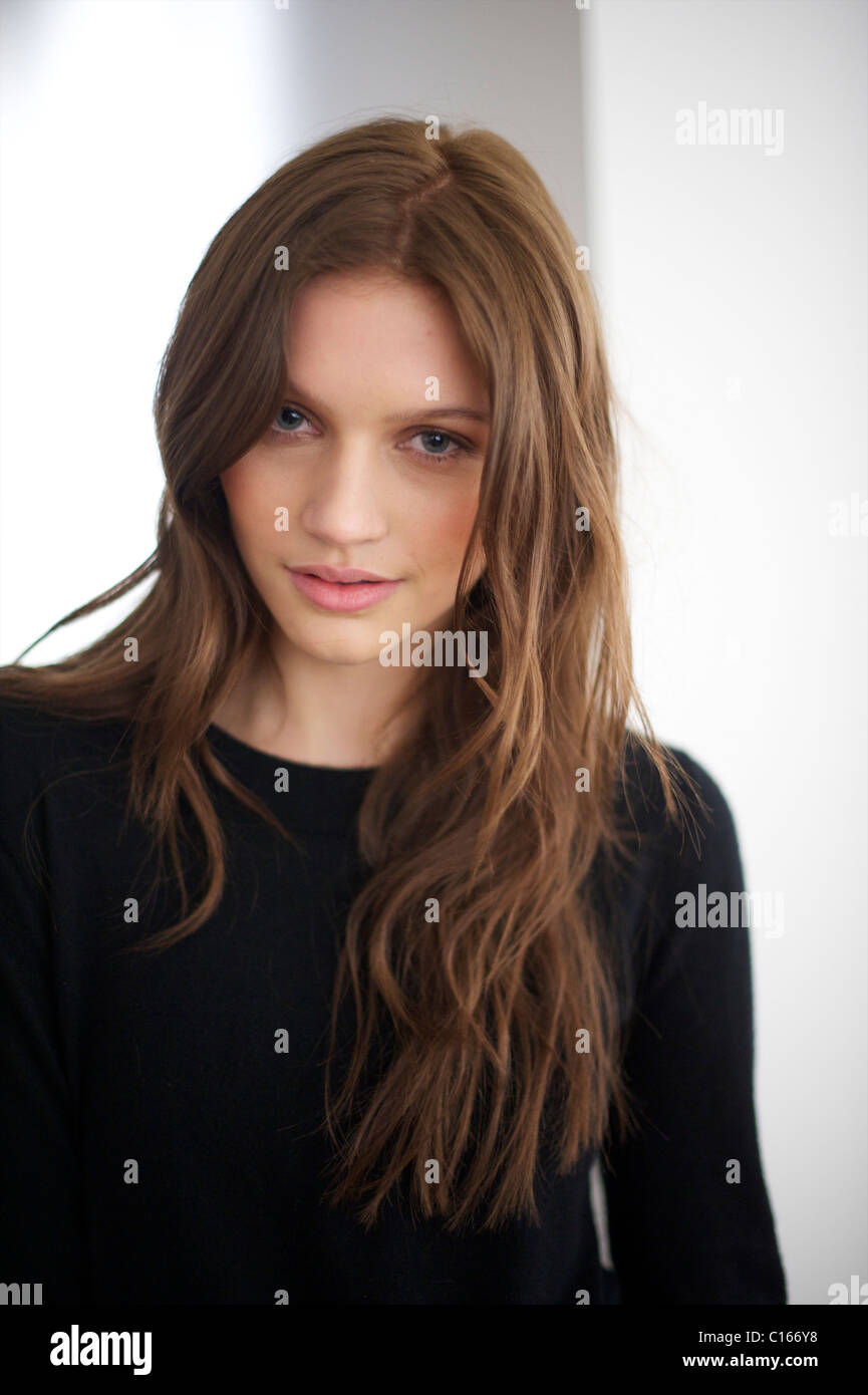 A model poses for a photograph backstage before the Matthew Williamson ...