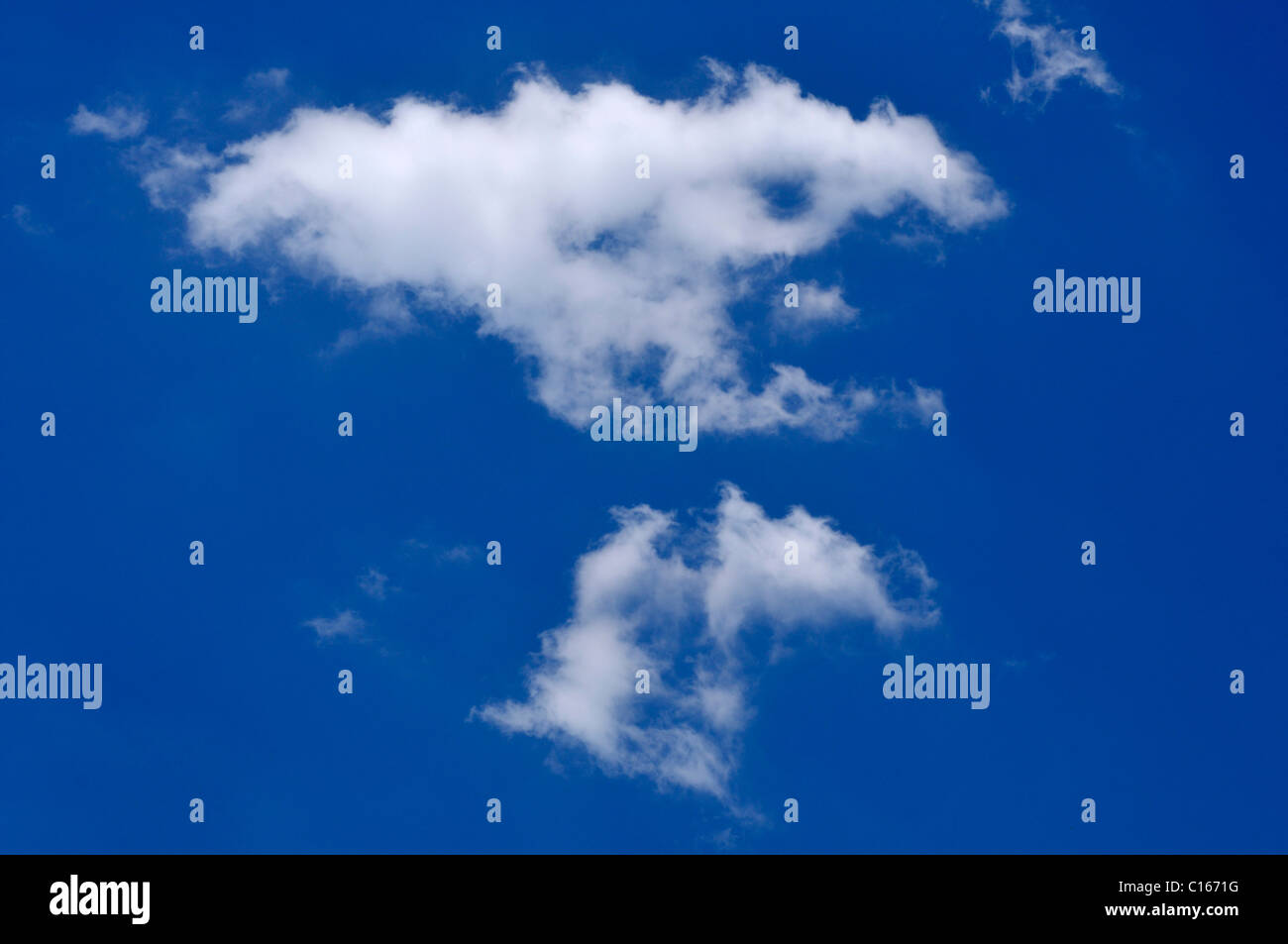 Clouds in a deep blue sky Stock Photo - Alamy