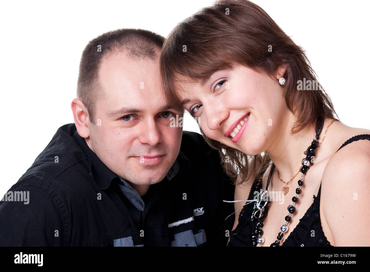 Portrait Of A Beautiful Young Happy Smiling Couple Isolated On White