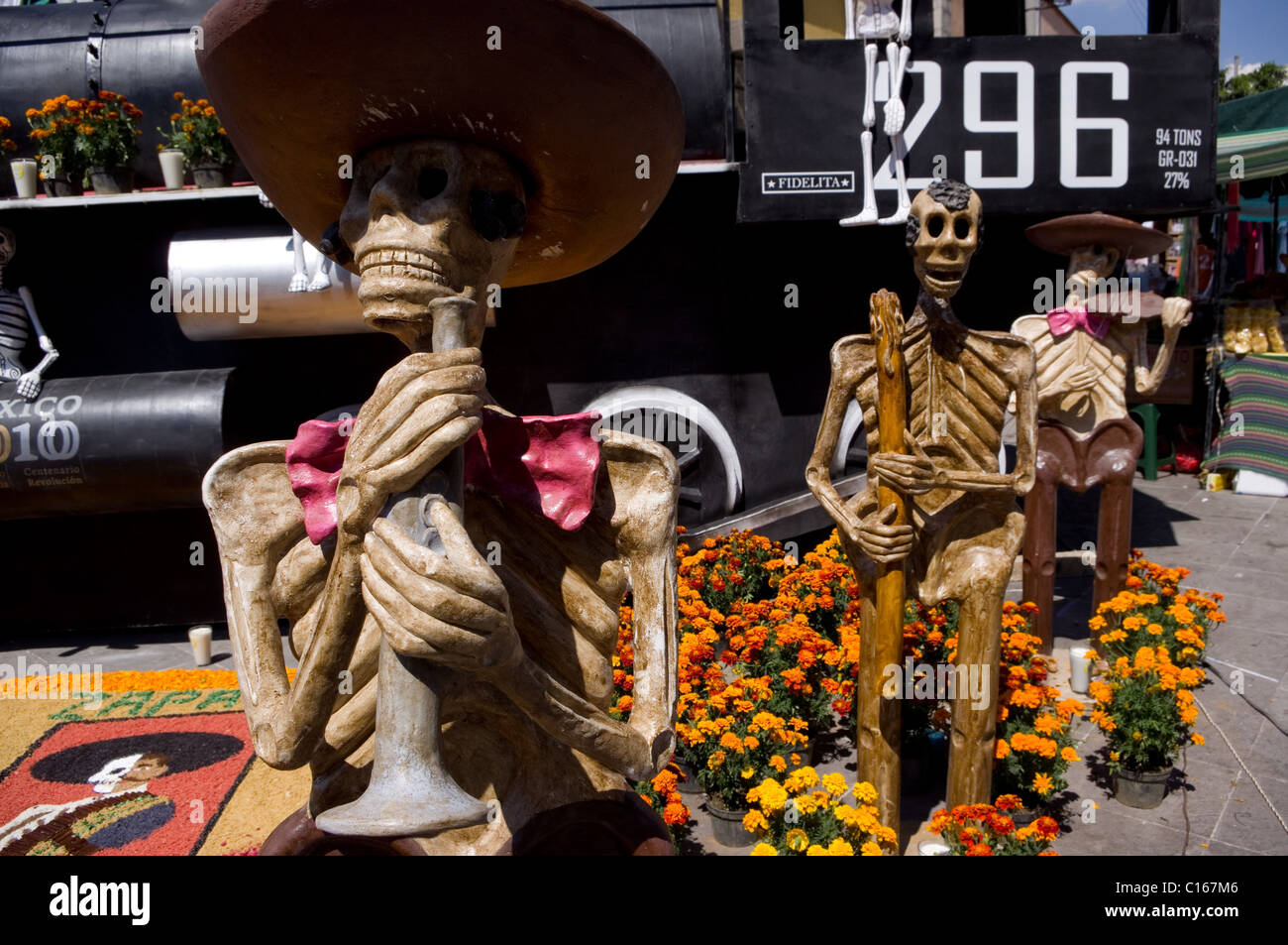 Mexican skeleton musician as part of a day of the dead ofrenda in ...