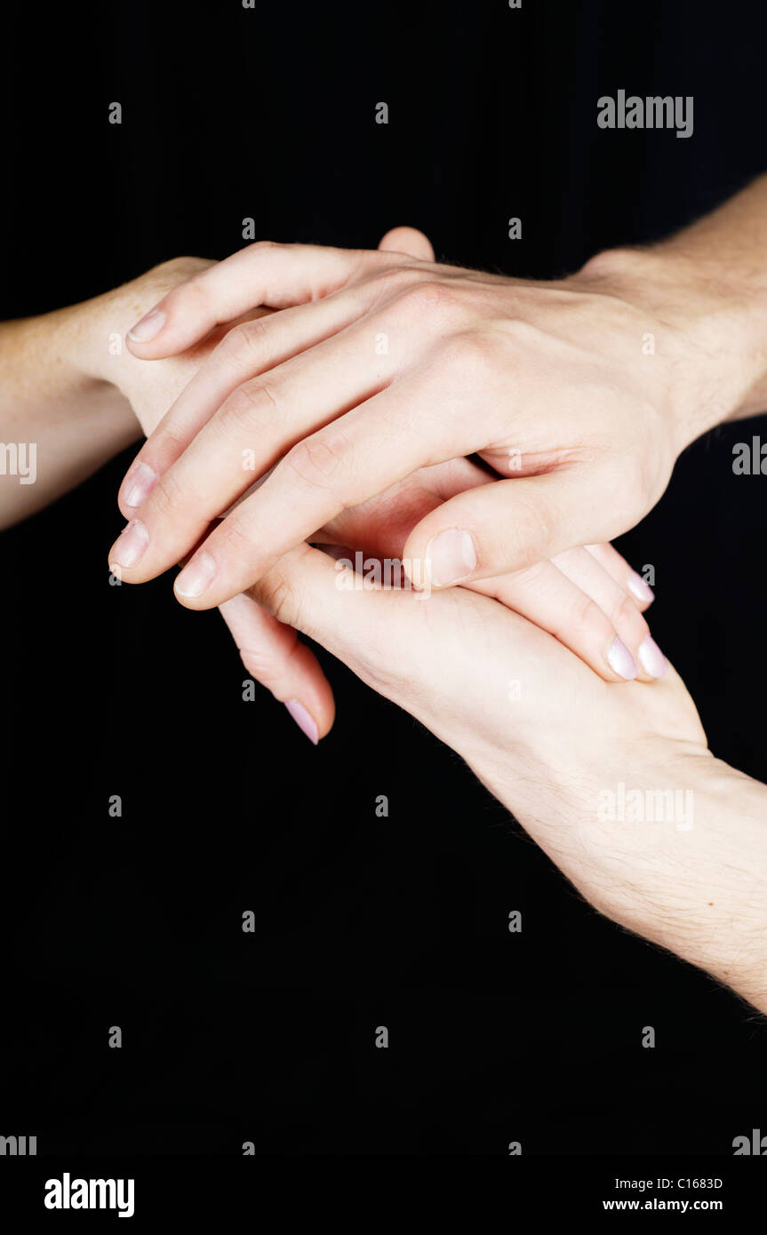 Man holding woman's hand Stock Photo - Alamy