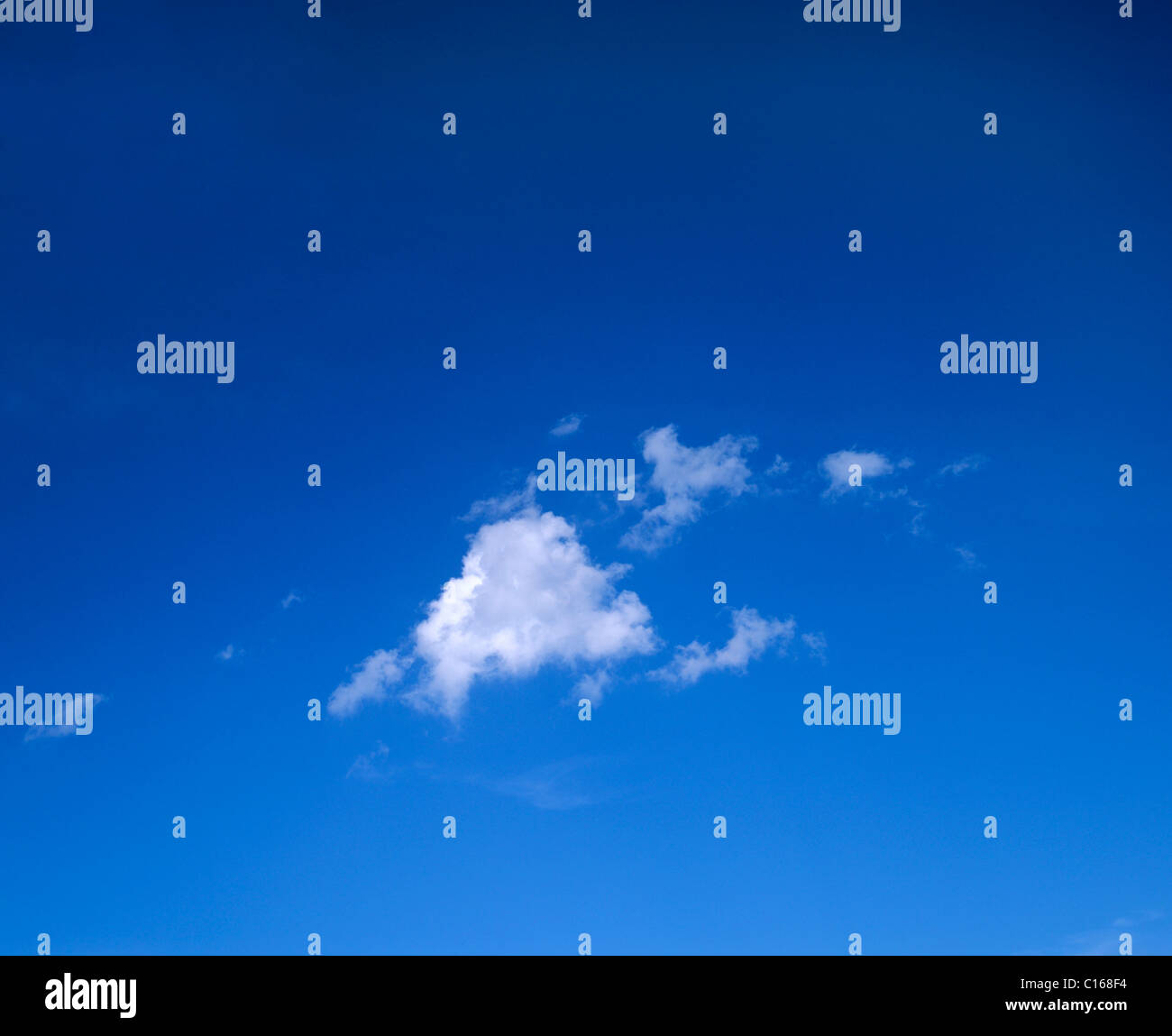 Small cloud in front of a blue sky Stock Photo - Alamy
