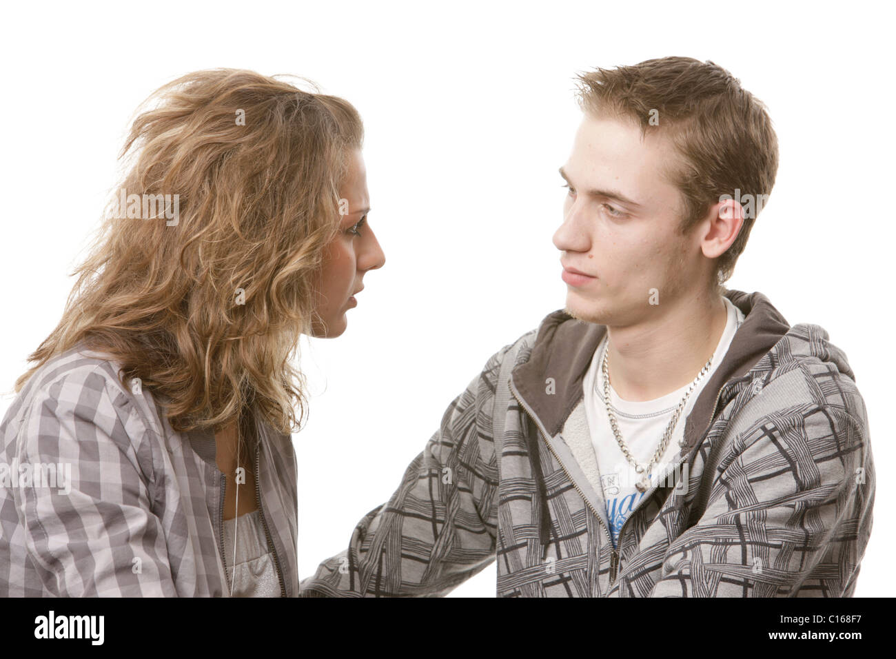 Teenage girl looking angrily at her boyfriend Stock Photo - Alamy