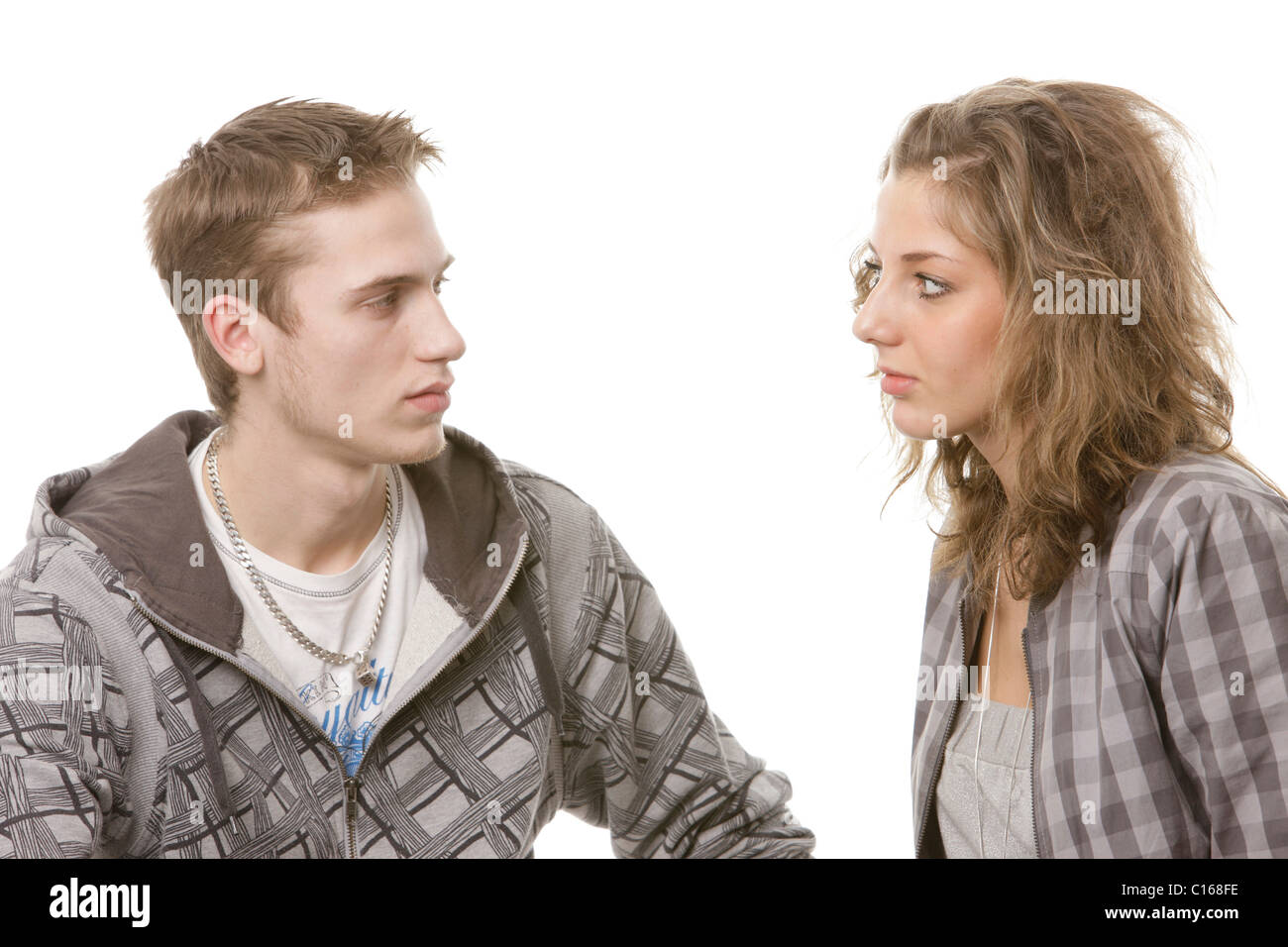 Teengae girl looking sceptically at her boyfriend Stock Photo - Alamy
