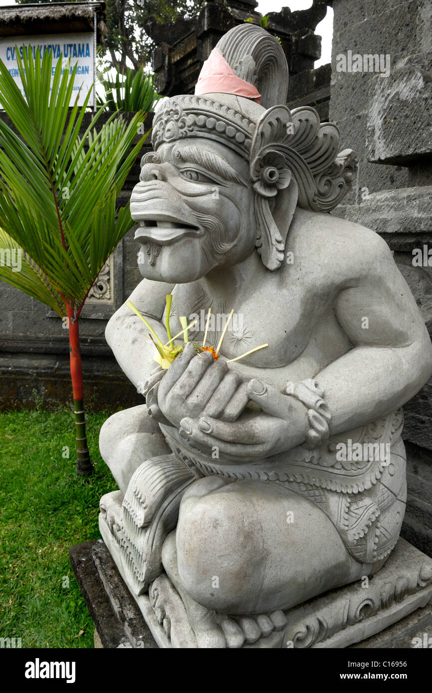 Figure from Balinese mythology near Rendang with an offering, Bali ...