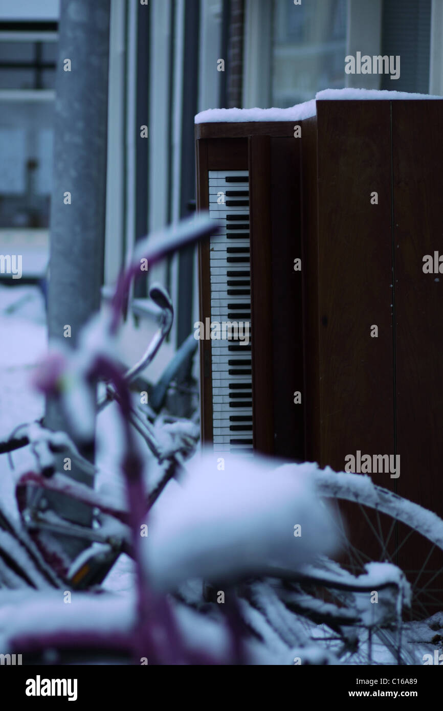 Piano covered with snow Stock Photo - Alamy